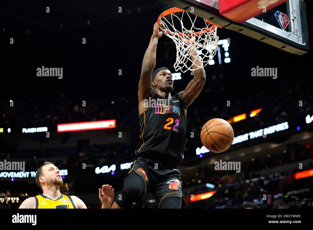 Miami Heat forward Jimmy Butler (22) dunks over Utah Jazz forward Bojan ...