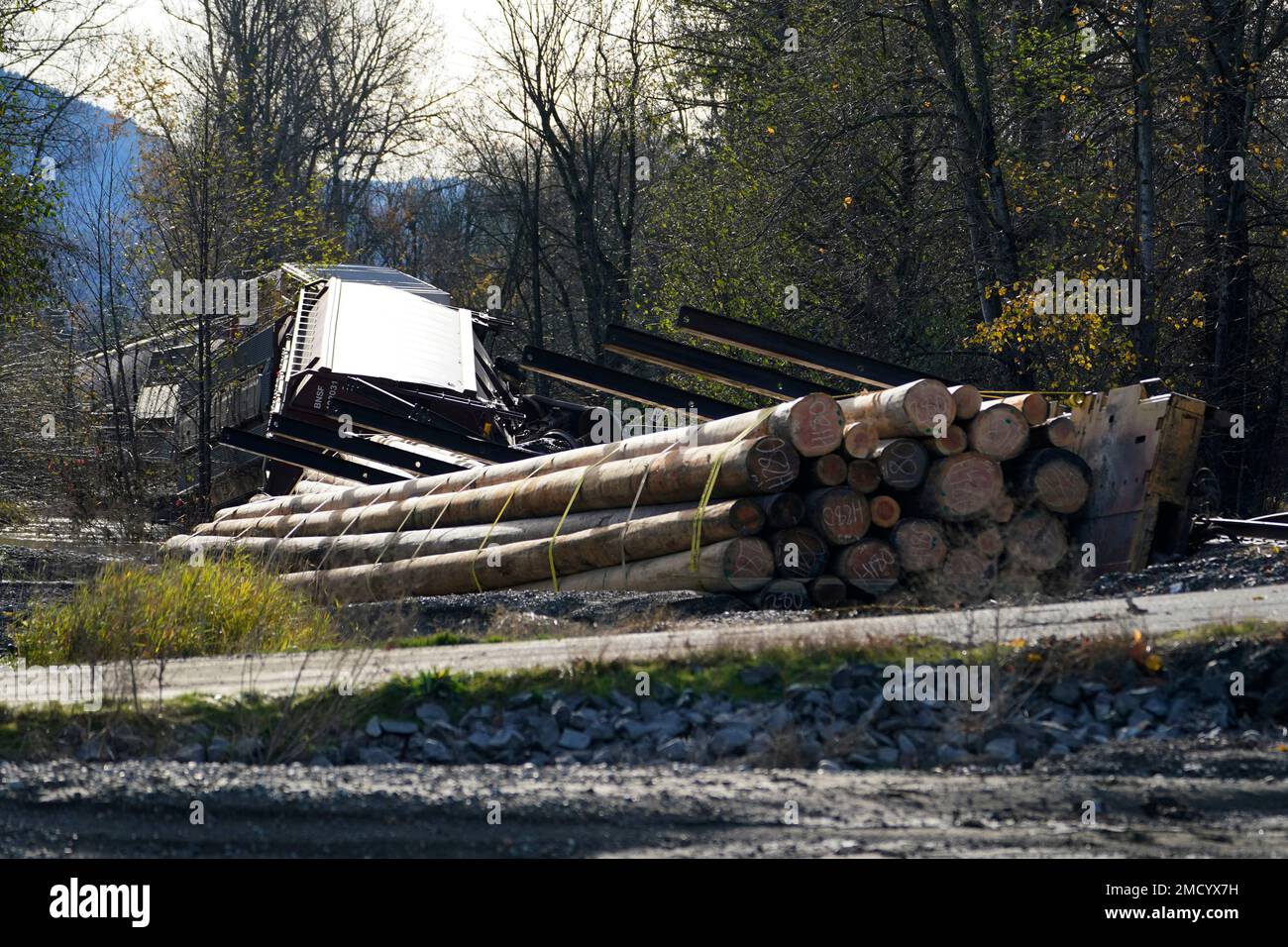 Derailed railroad cars sit near flood-damaged tracks at a BNSF rail ...