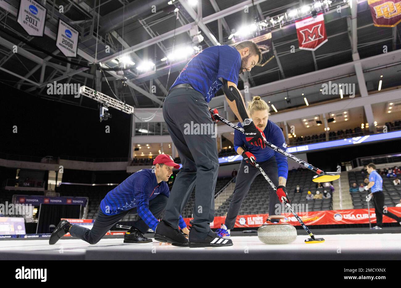 Team Shuster's John Shuster, from left, casts the rock as John Landsteiner and Matt Hamilton ...