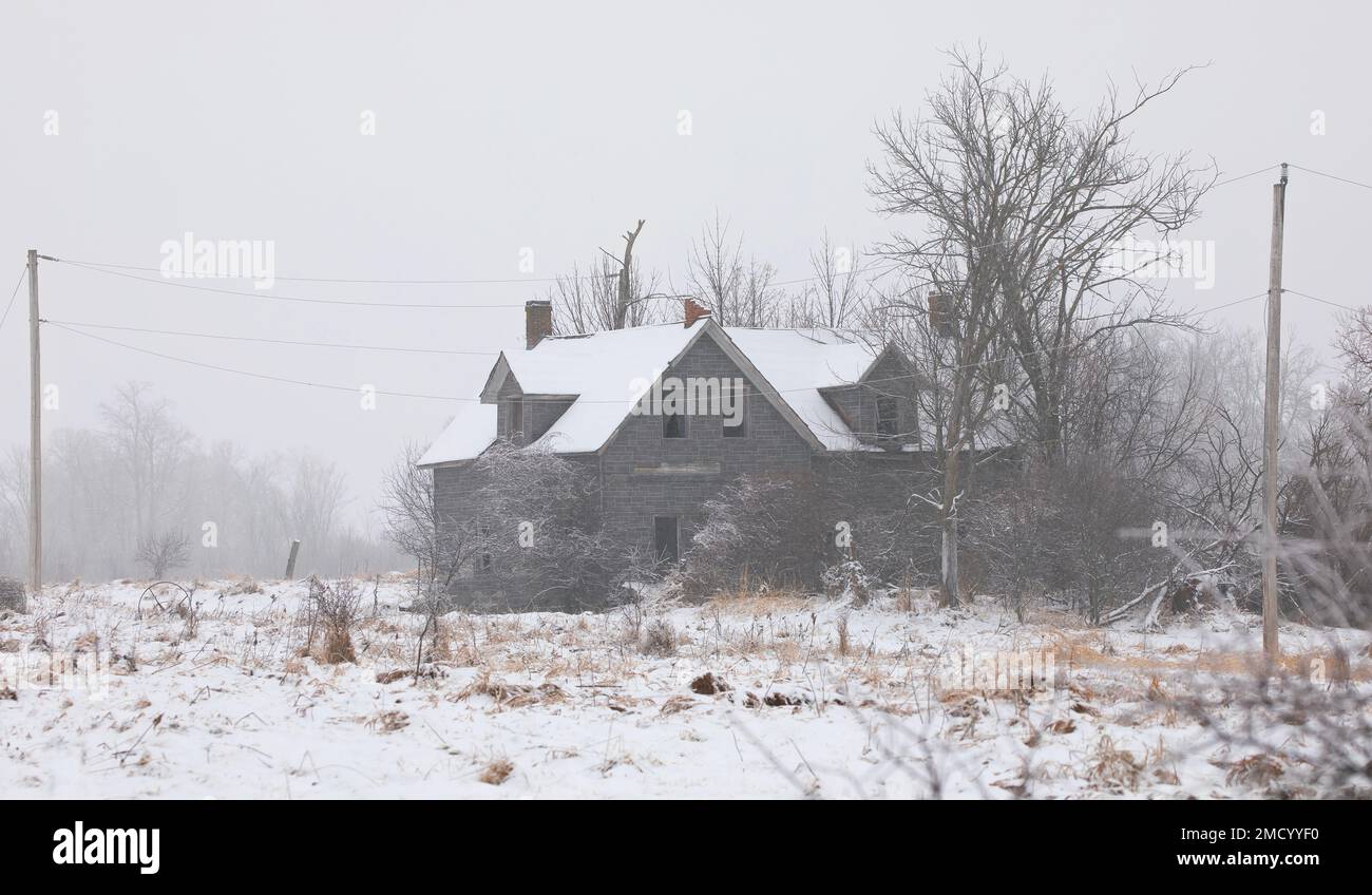 An old black and white abandoned haunted spooky looking farmhouse in ...