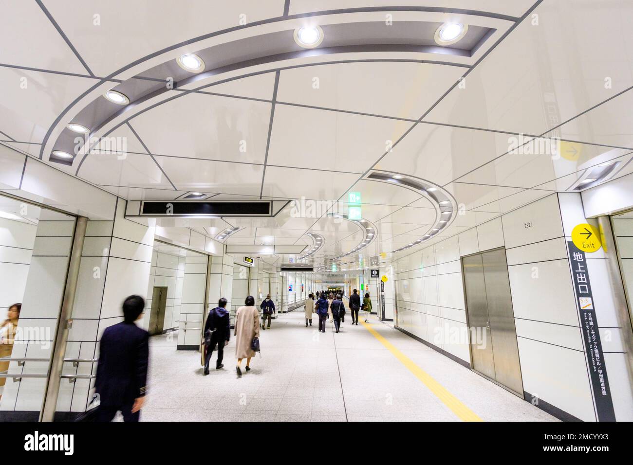 Tokyo. Interior of white underground pedestrian tunnel from the ...