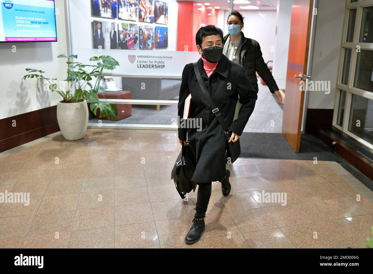 Investigative journalist Maria Ressa, of the Philippines, center, and ...