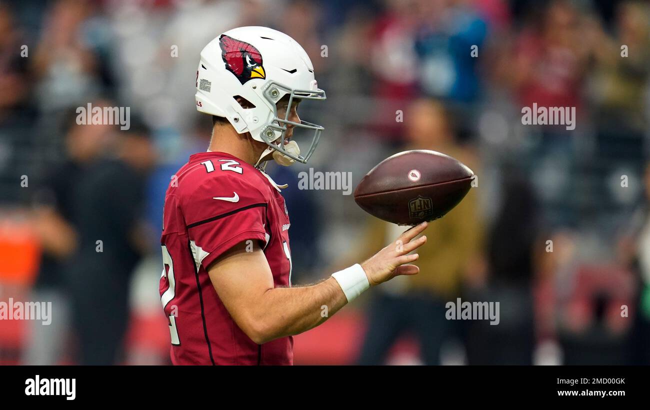 Arizona Cardinals quarterback Colt McCoy spins the ball on his fingers ...