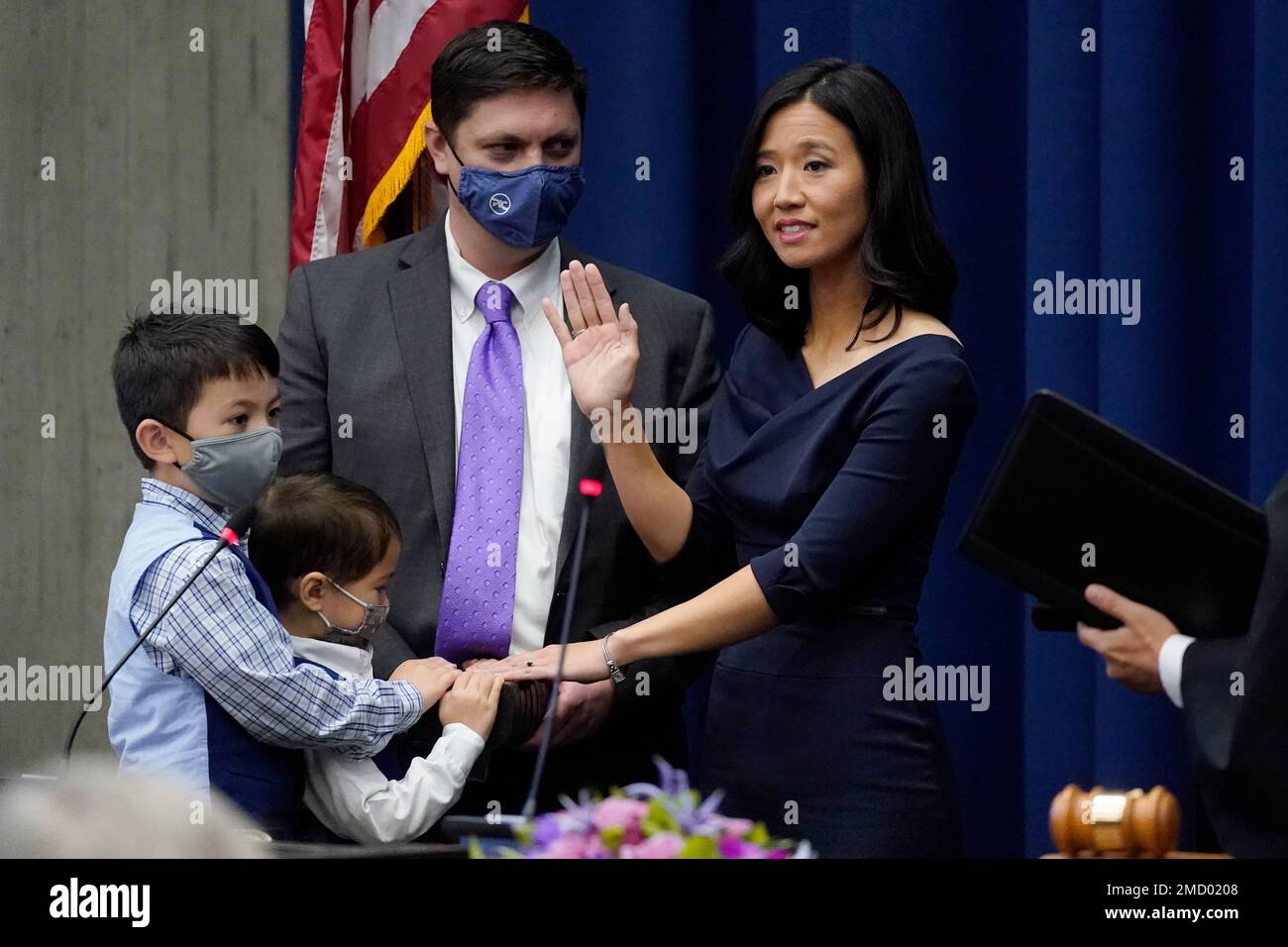 Michelle Wu raises her hand as she is sworn-in as Boston Mayor during a ...