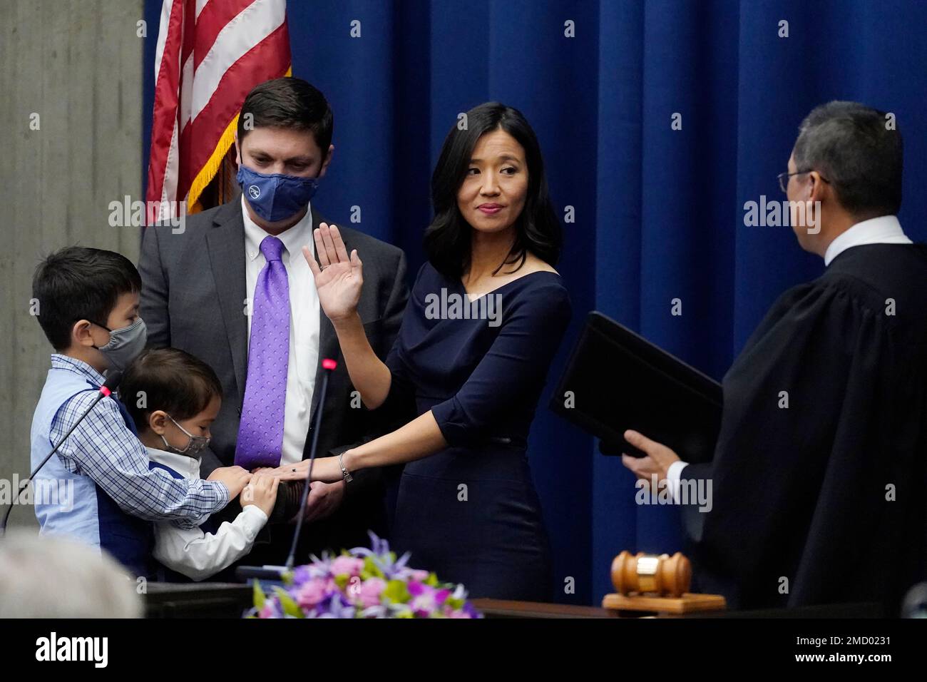 Michelle Wu raises her hand as she is sworn-in as Boston Mayor during a ...