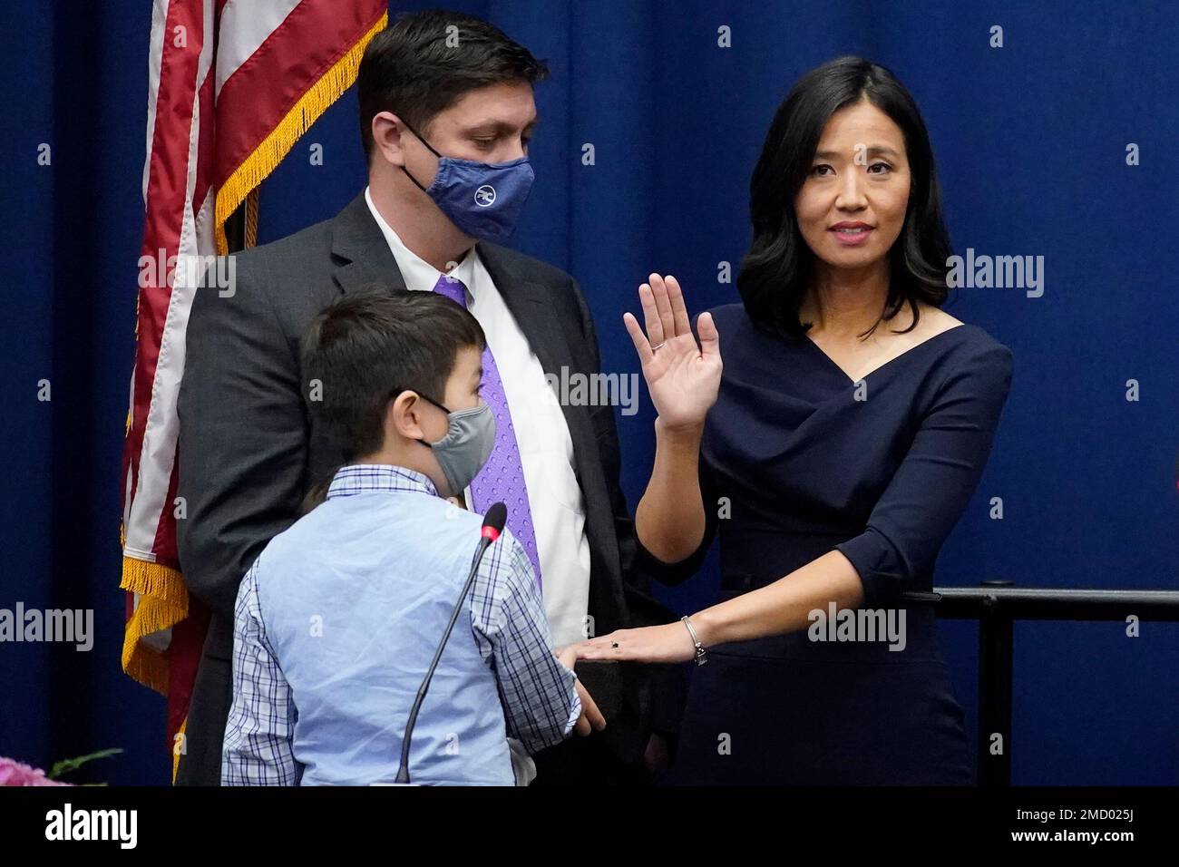 Michelle Wu raises her hand as she is sworn-in as Boston Mayor during a ...