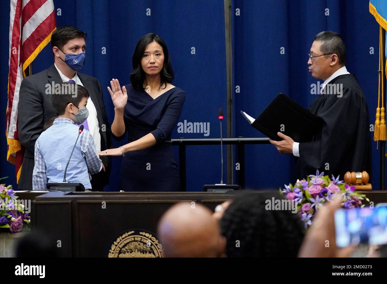 Michelle Wu raises her hand as she is sworn-in as Boston Mayor during a ...