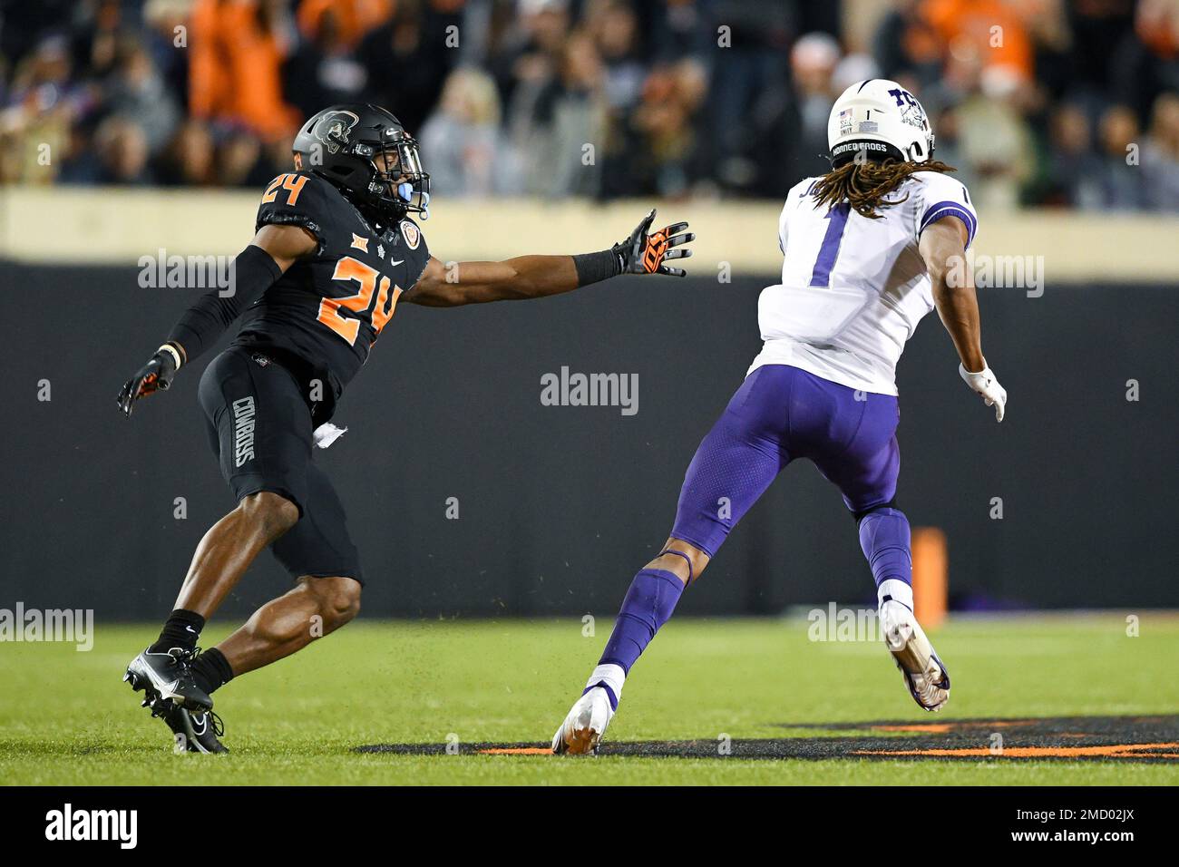 Oklahoma State cornerback Jarrick Bernard-Converse (24) reaches for TCU ...