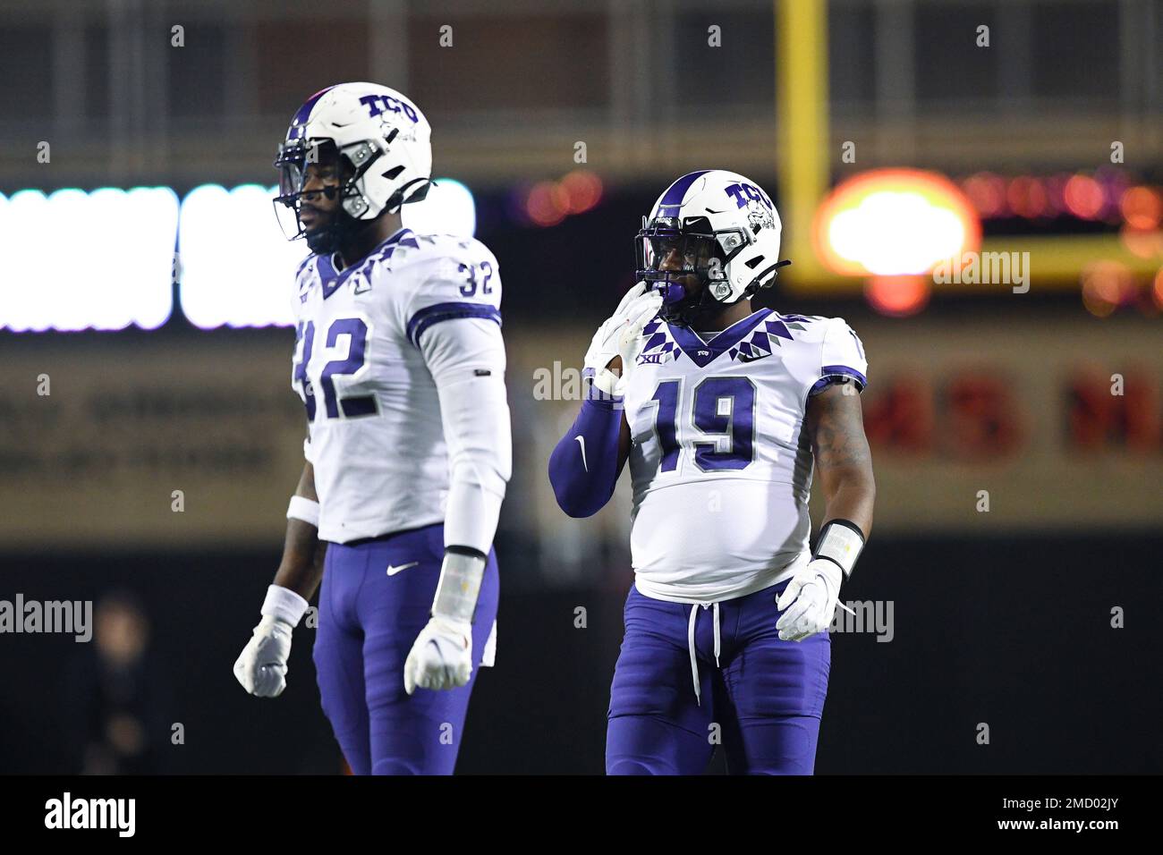TCU defensive end Ochaun Mathis (32) and TCU linebacker Shadrach Banks ...