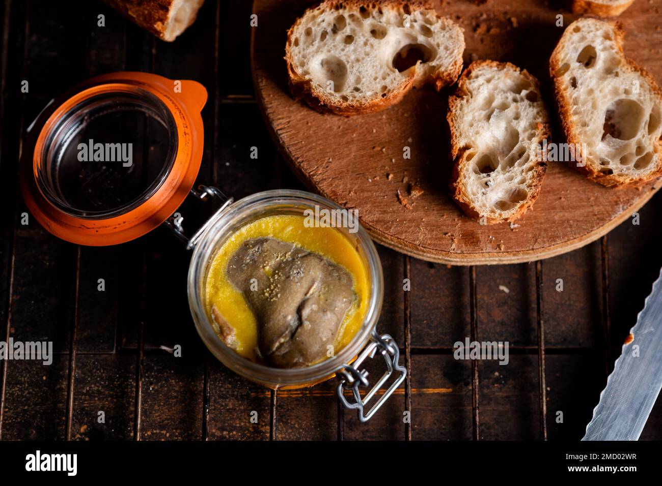 jar of foie gras and French baguette wedges. Preparing canapes Stock ...