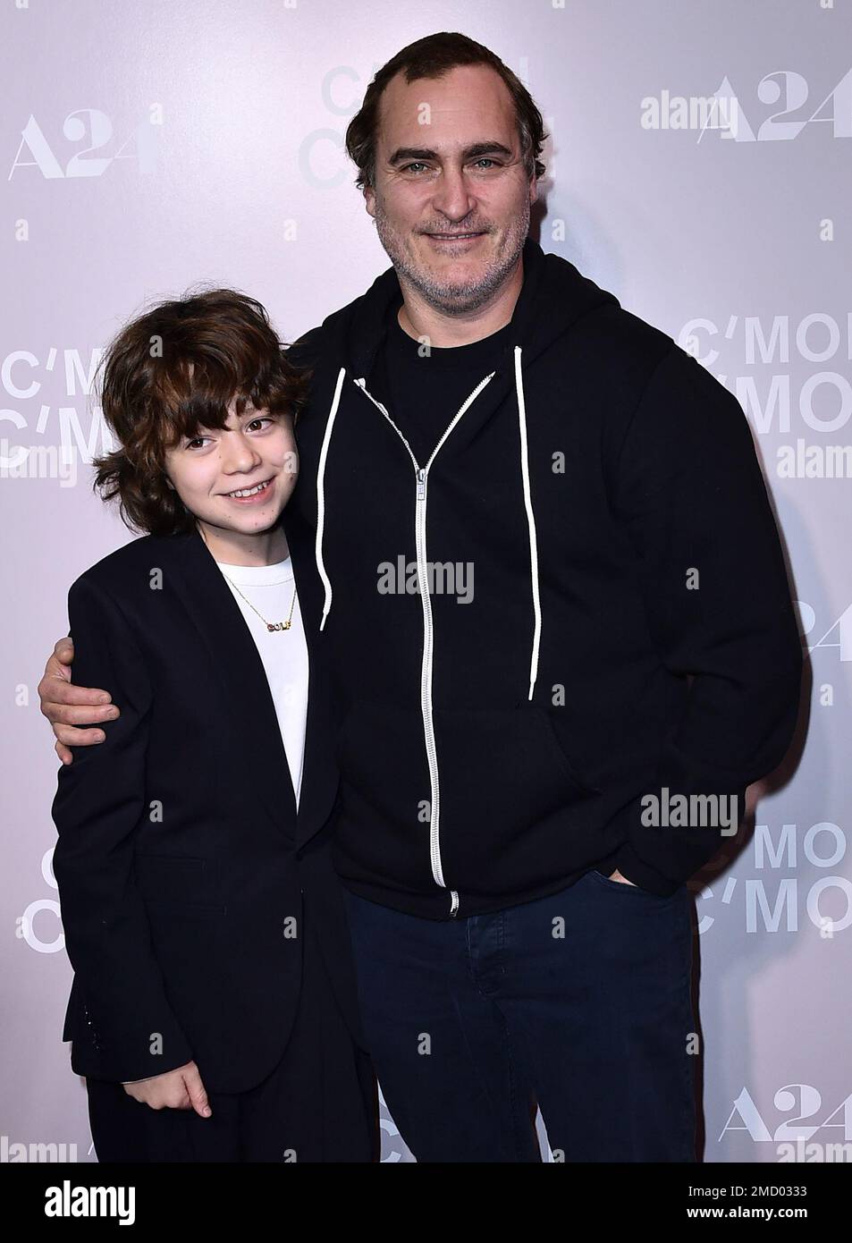 Woody Norman, left, and Joaquin Phoenix arrive at a special screening ...