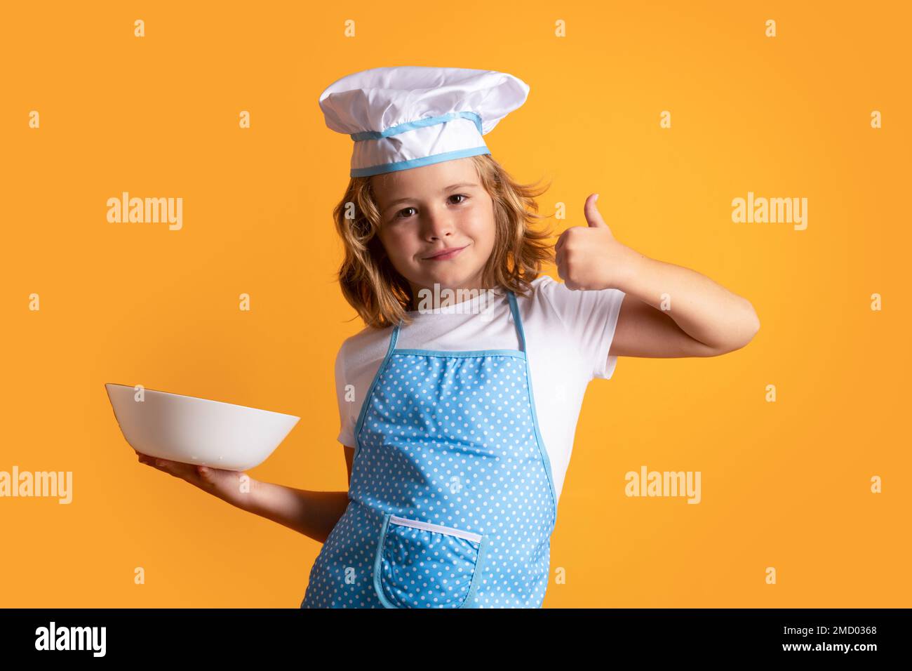 Funny kid chef cook with kitchen plate, studio portrait. Child chef ...