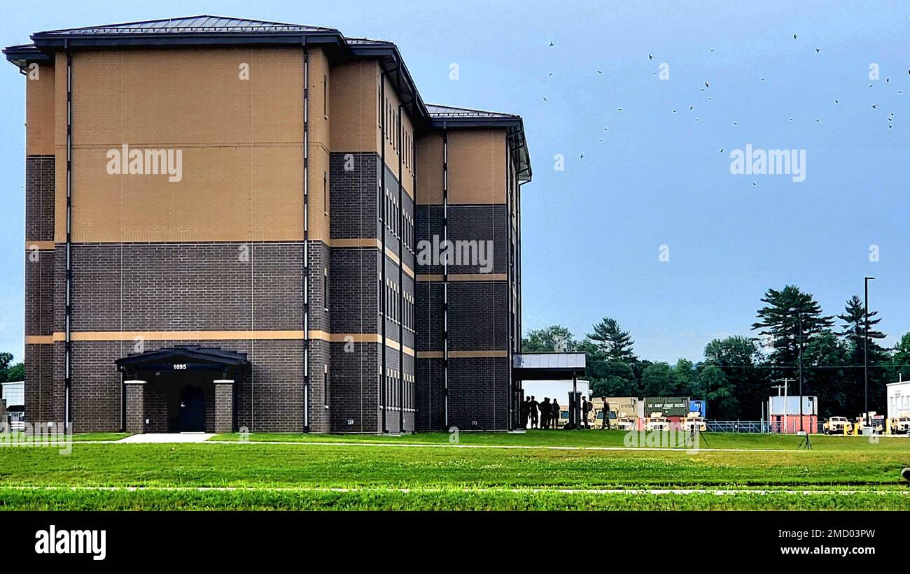 Troops are located outside the first of several four-story transient ...