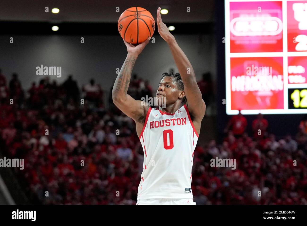 Houston guard Marcus Sasser shoots a three point basket during the ...