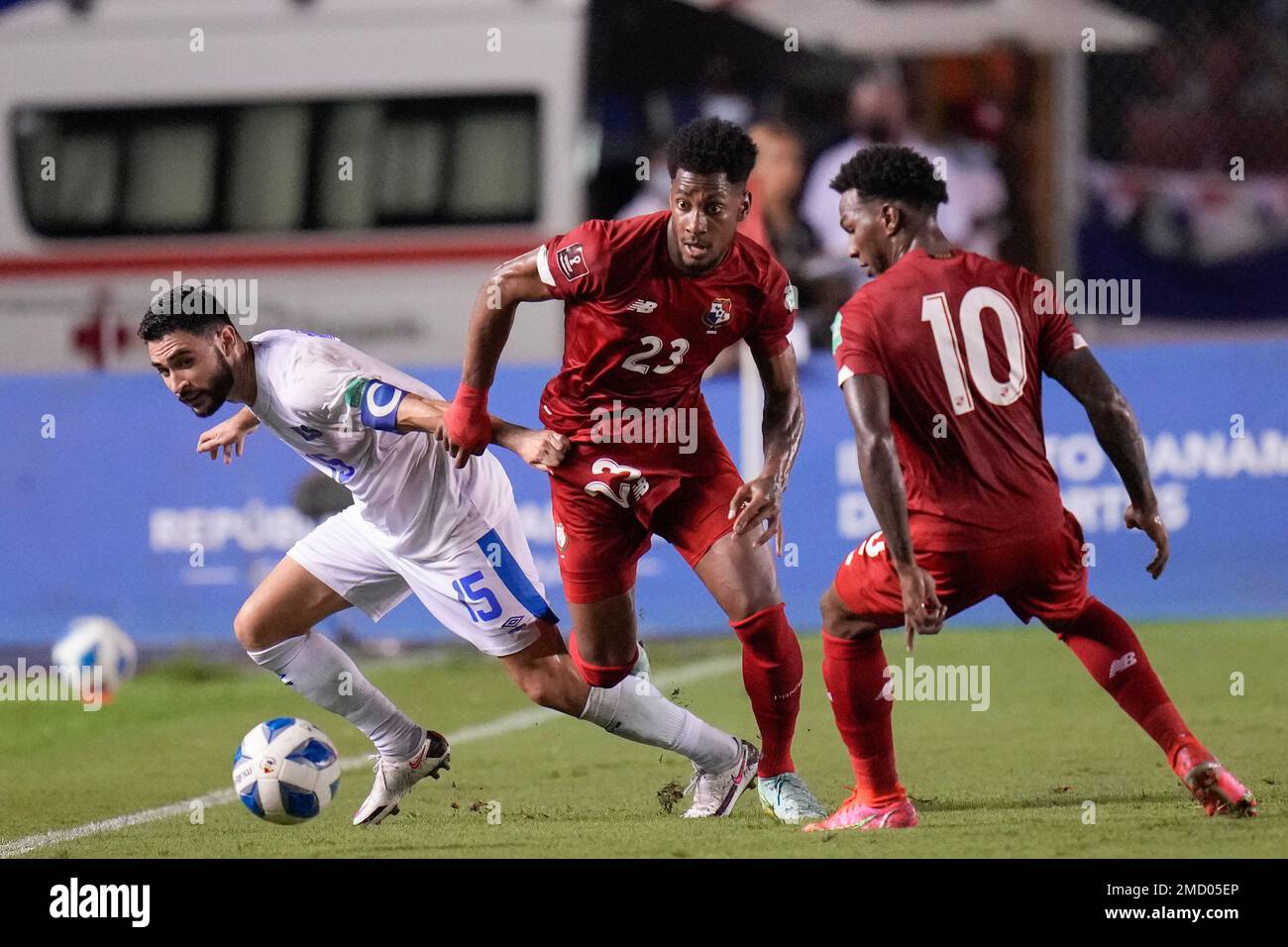 El Salvador's Alex Roldan, left, dribbles the ball challenged by Panama ...