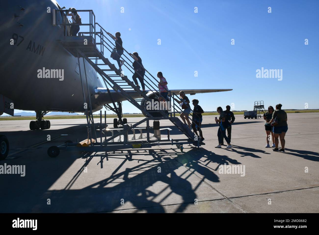 Spouses of 97th Air Mobility Wing Airmen board a KC-46 Pegasus at Altus ...