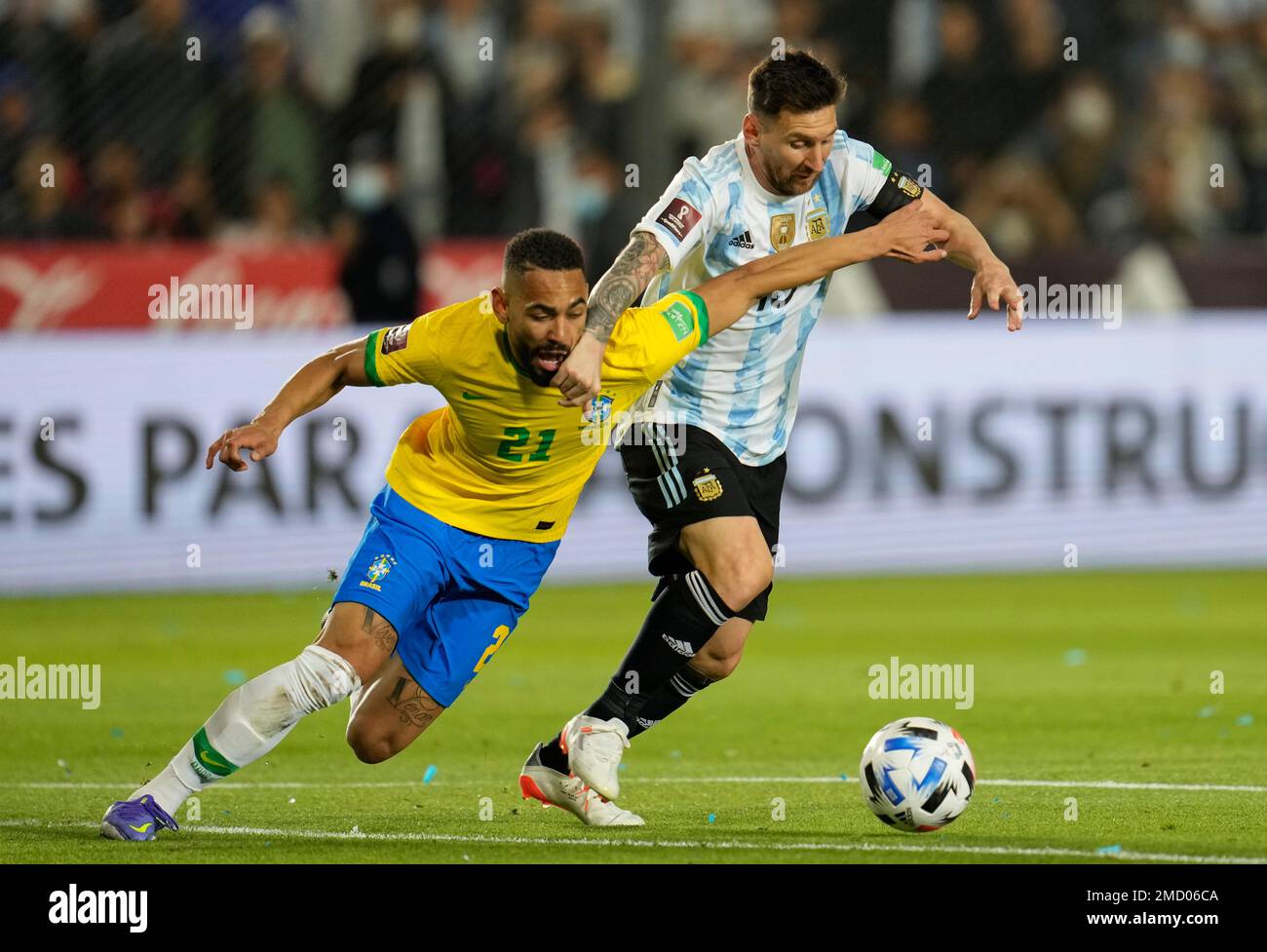 Argentina's Lionel Messi, right, and Brazil's Matheus Cunha battle for ...