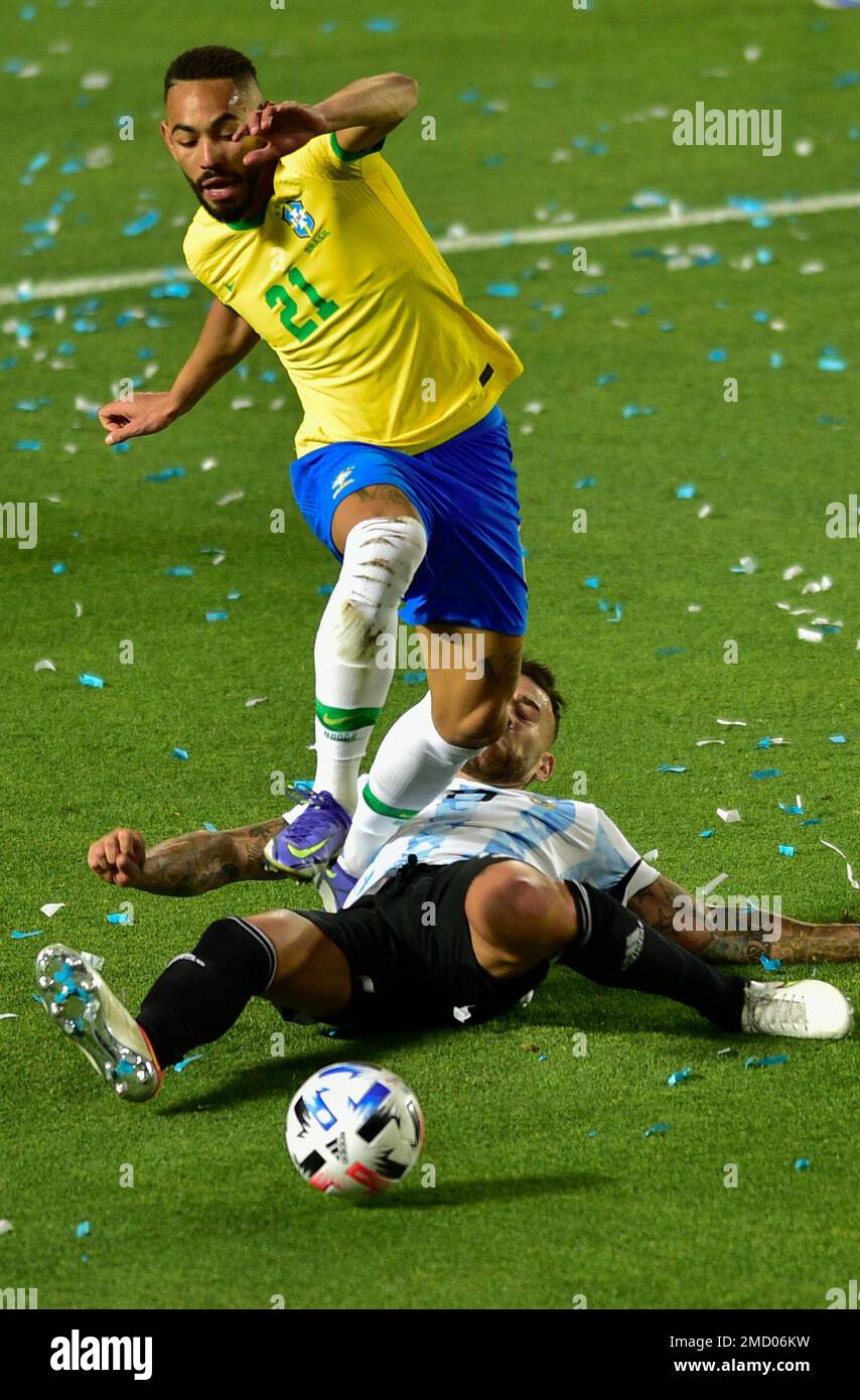 Brazil's Matheus Cunha, top, and Argentina's Giovani Lo Celso battle ...