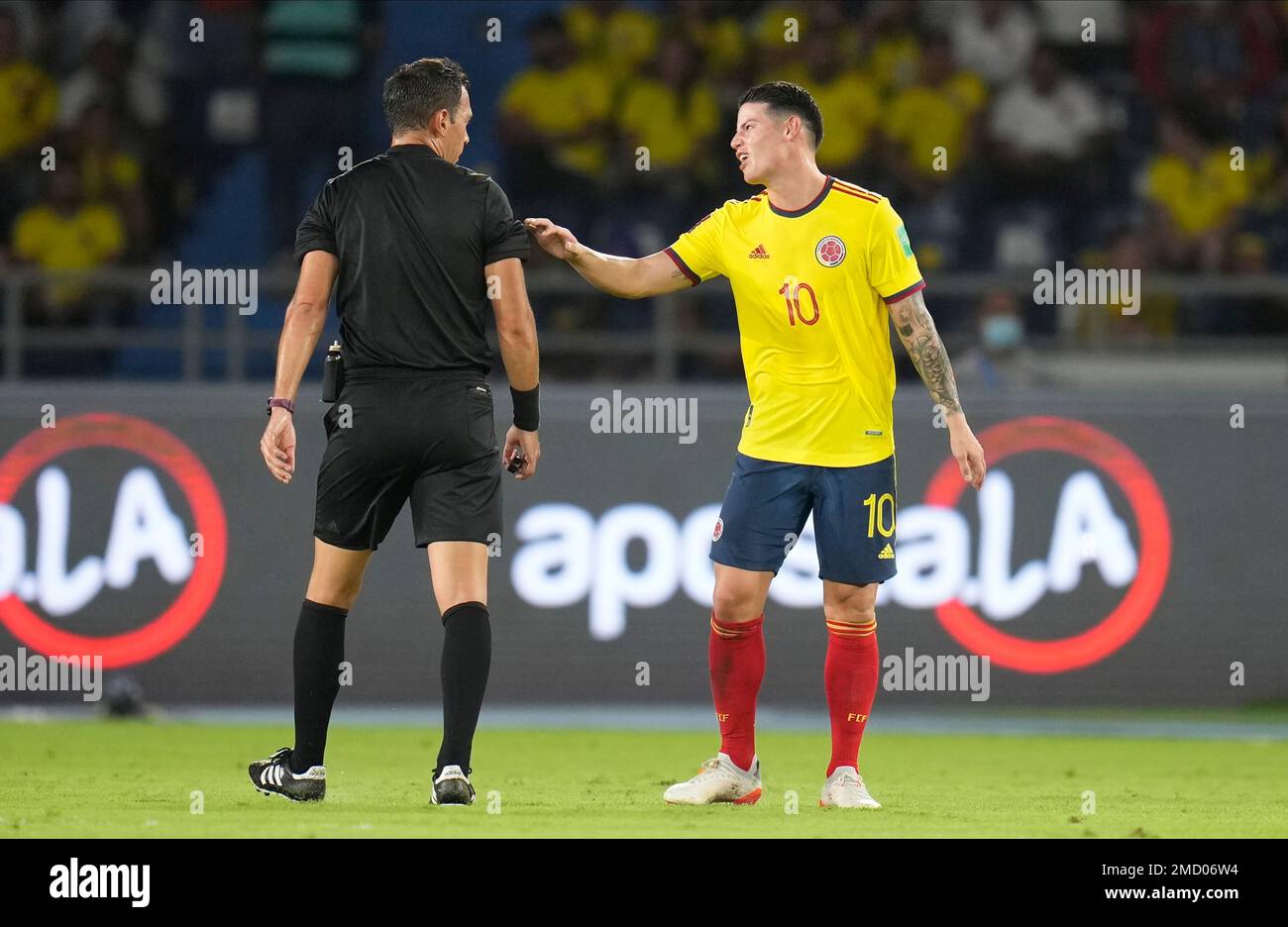 Colombia's James Rodriguez, left, talks with referee Facundo Tello ...