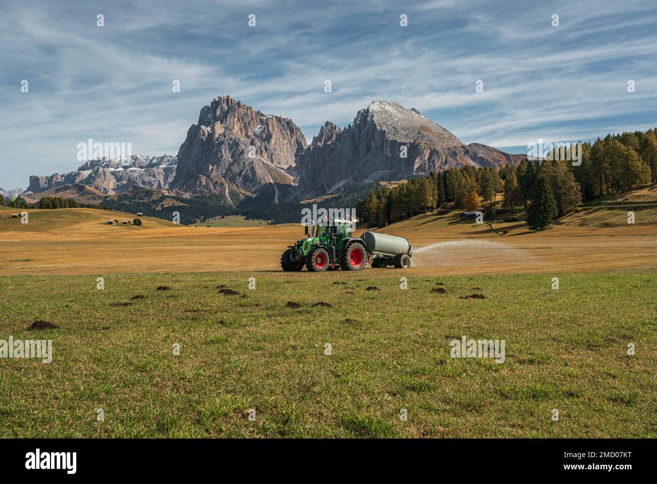 A Sprinkler on alpine grassland, Dolomite mountain landscapes in Alpe ...