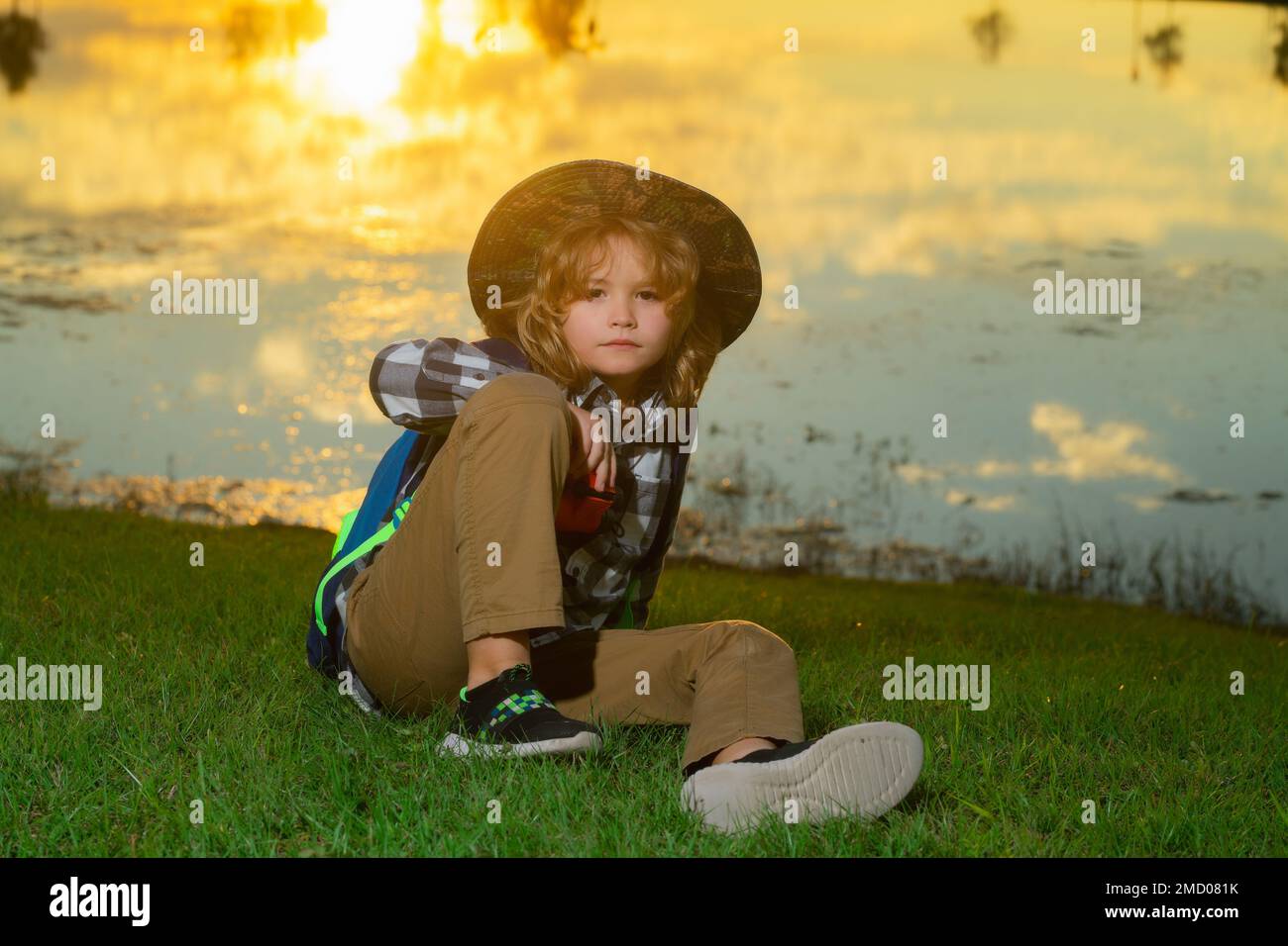 Kid with binoculars hiking at nature. Little explorer. Outdoor ...