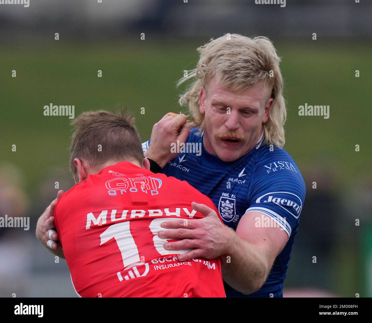 Brad Fash #13 of Hull FC tackles Aaron Murphy #18 of Sheffield Eagles during the Rugby League ...