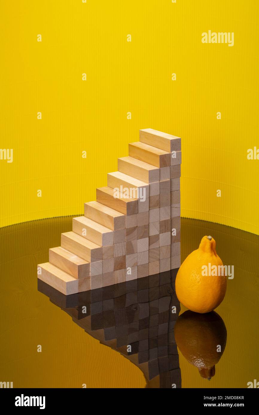 Pyramid of wooden bars and lemon with reflection Stock Photo - Alamy