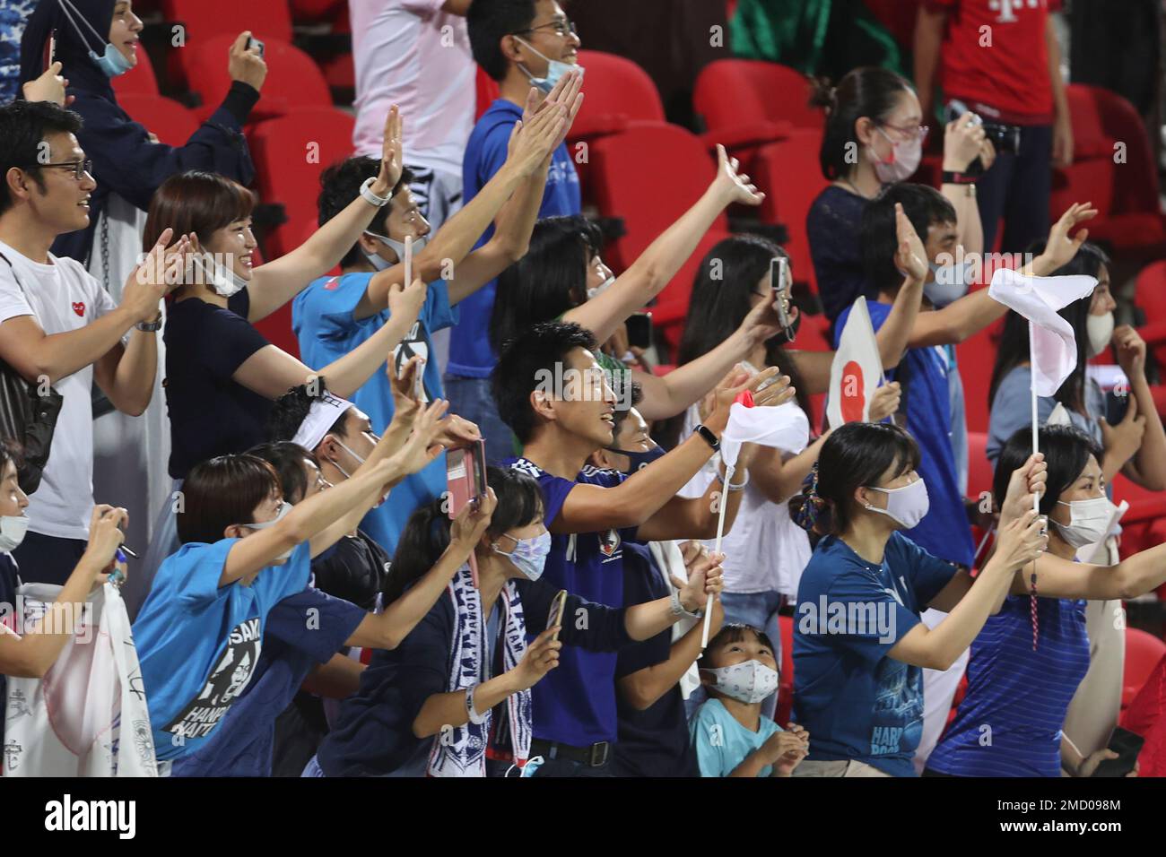 Japan's fans watch a qualifying soccer match for the FIFA World Cup Qatar 2022 between Oman and ...