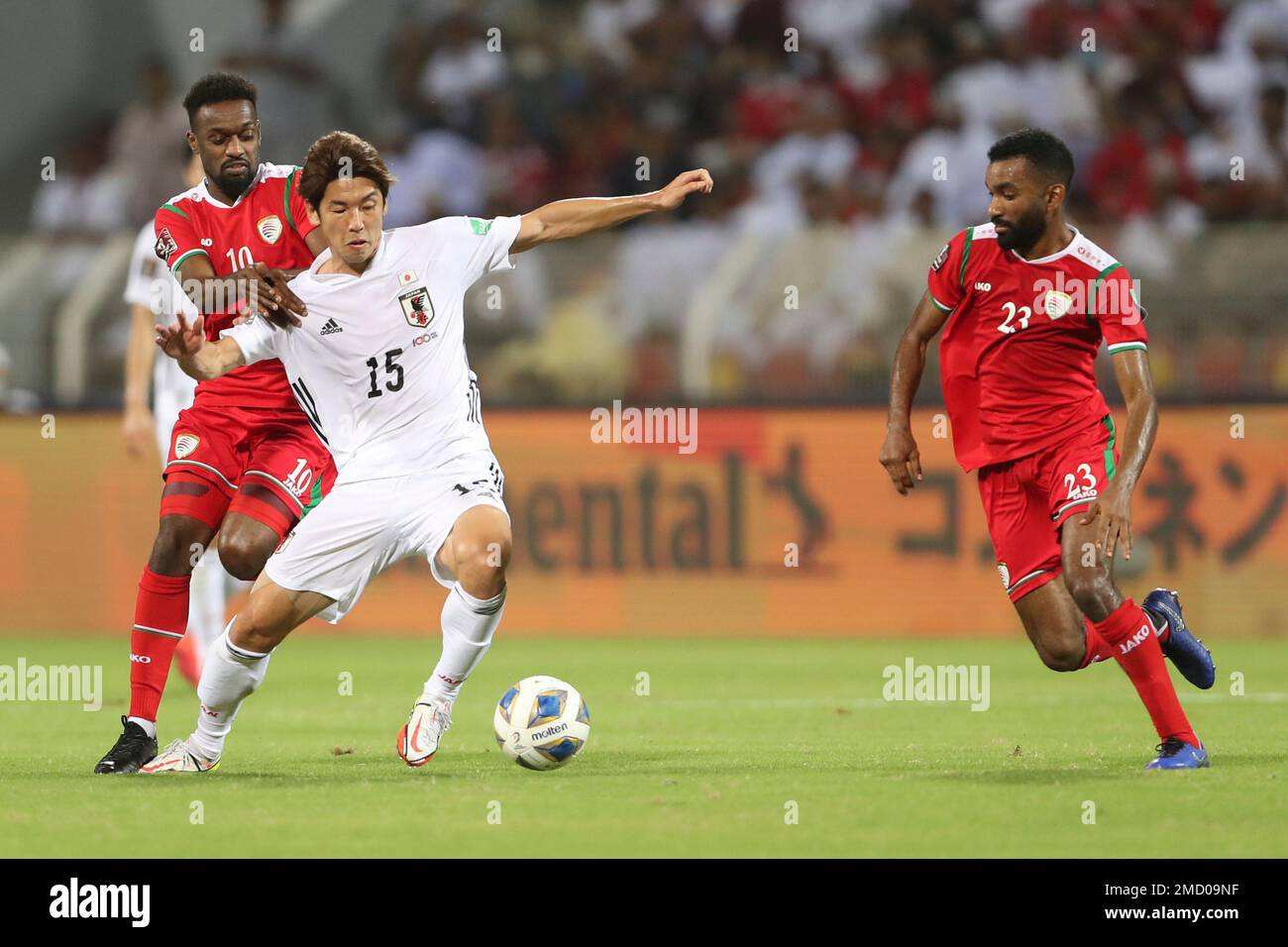Japan's Yuya Osako, front, and Oman's Mohsin Johar fight for the ball ... Japan's Yuya Osako, front, and Oman's Mohsin Johar fight for the ball ...
