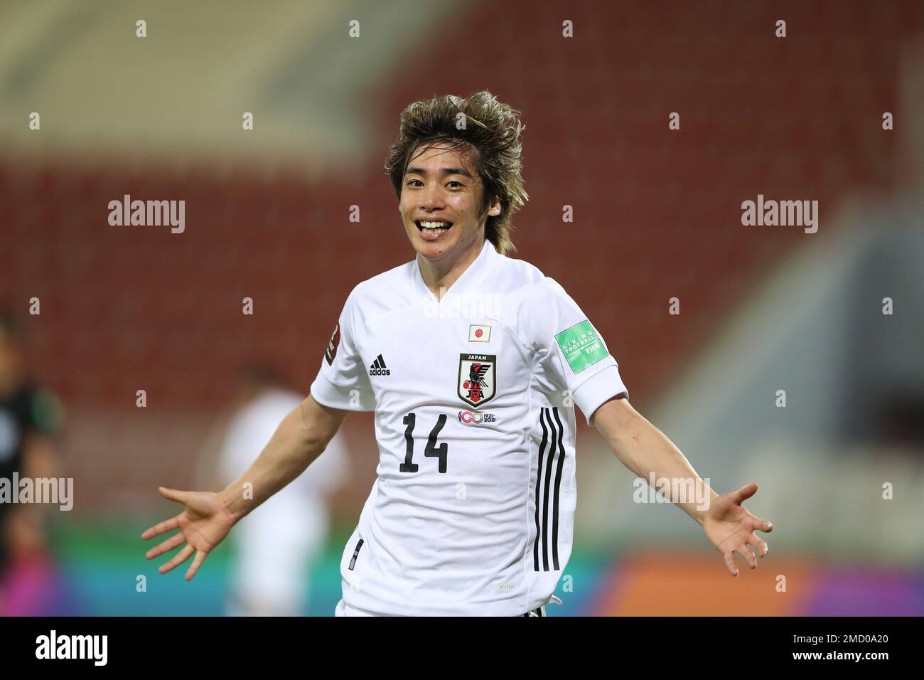 Japan's Junya Ito celebrates after a goal during a a qualifying soccer ...