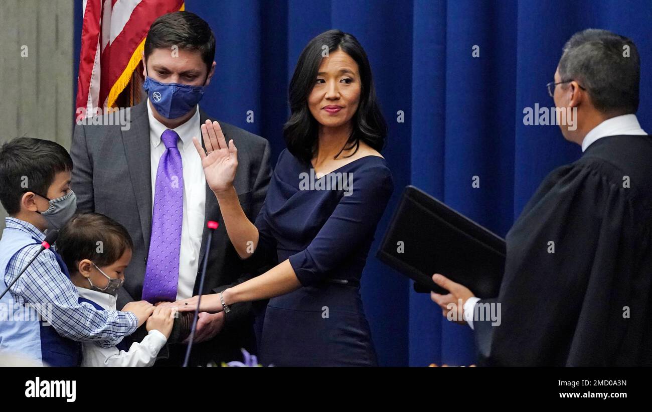 Michelle Wu raises her hand as she is sworn-in as Boston Mayor during a ...
