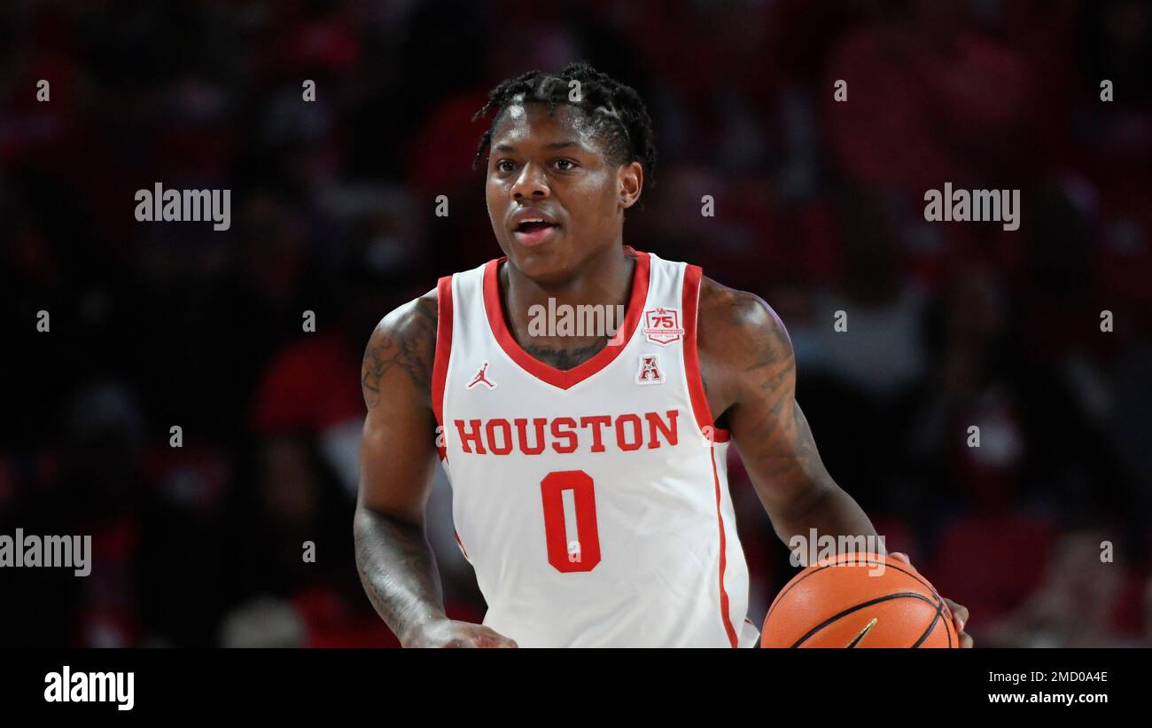 Houston guard Marcus Sasser (0) controls the ball against Rice during ...