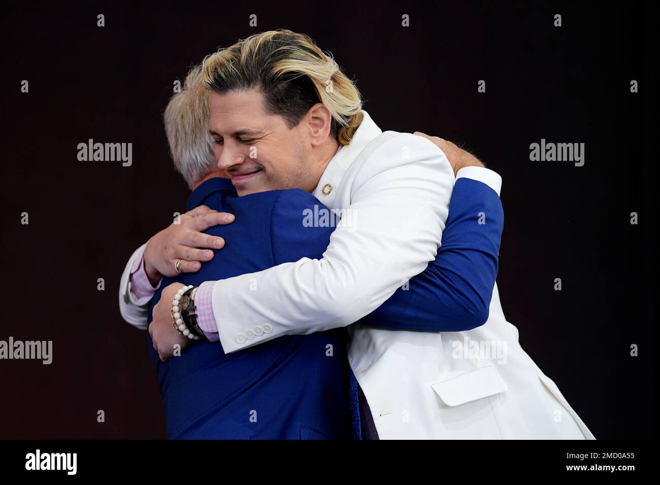 Michael Voris, left, founder of Church Militant, hugs activist Milo ...