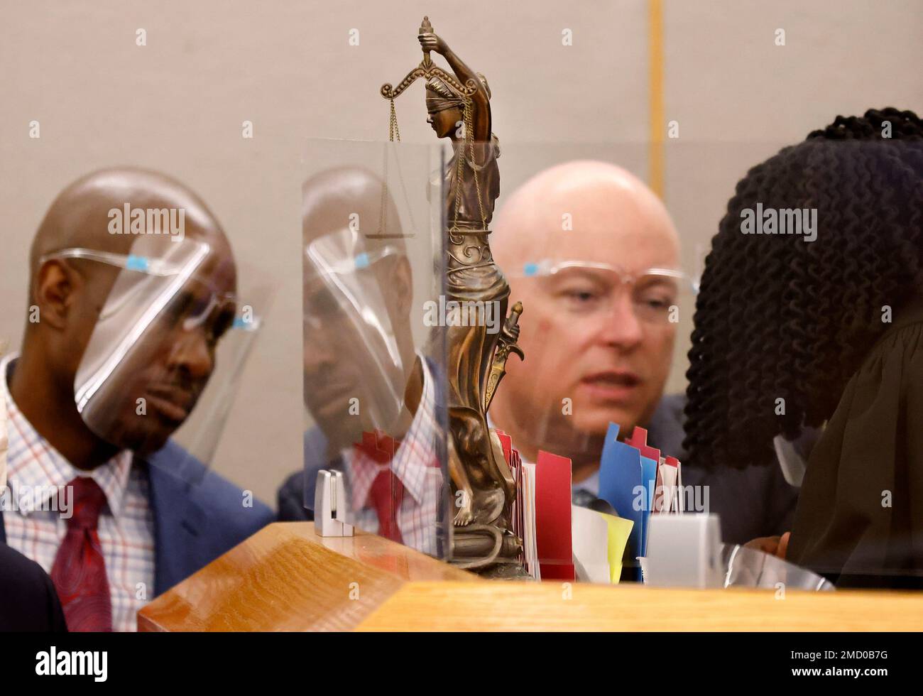 Prosecutor Glen Fitzmartin (center) and defense attorney Kobby Warren ...