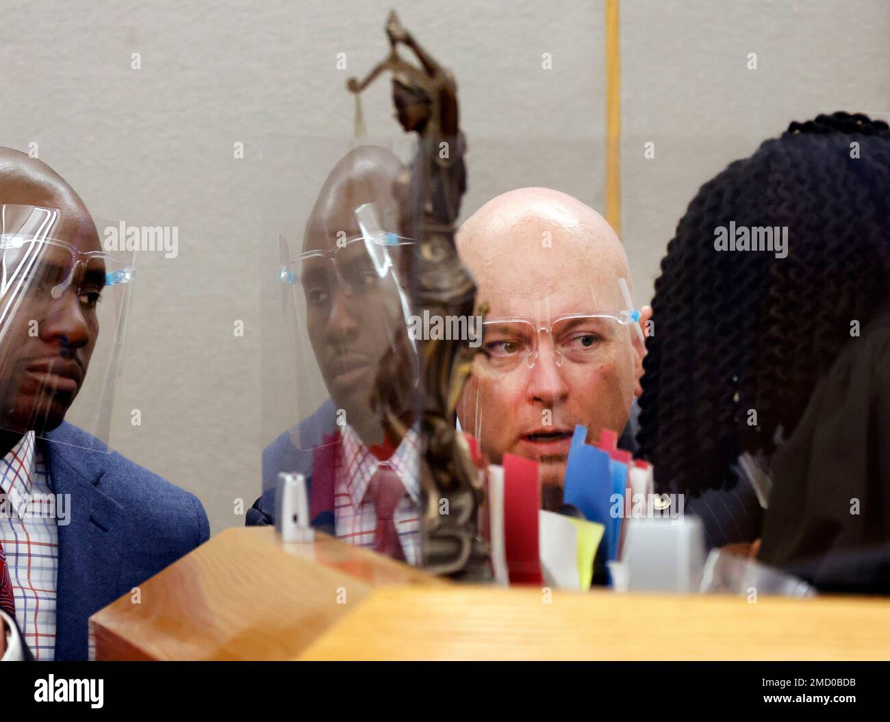 Prosecutor Glen Fitzmartin (center) and defense attorney Kobby Warren ...
