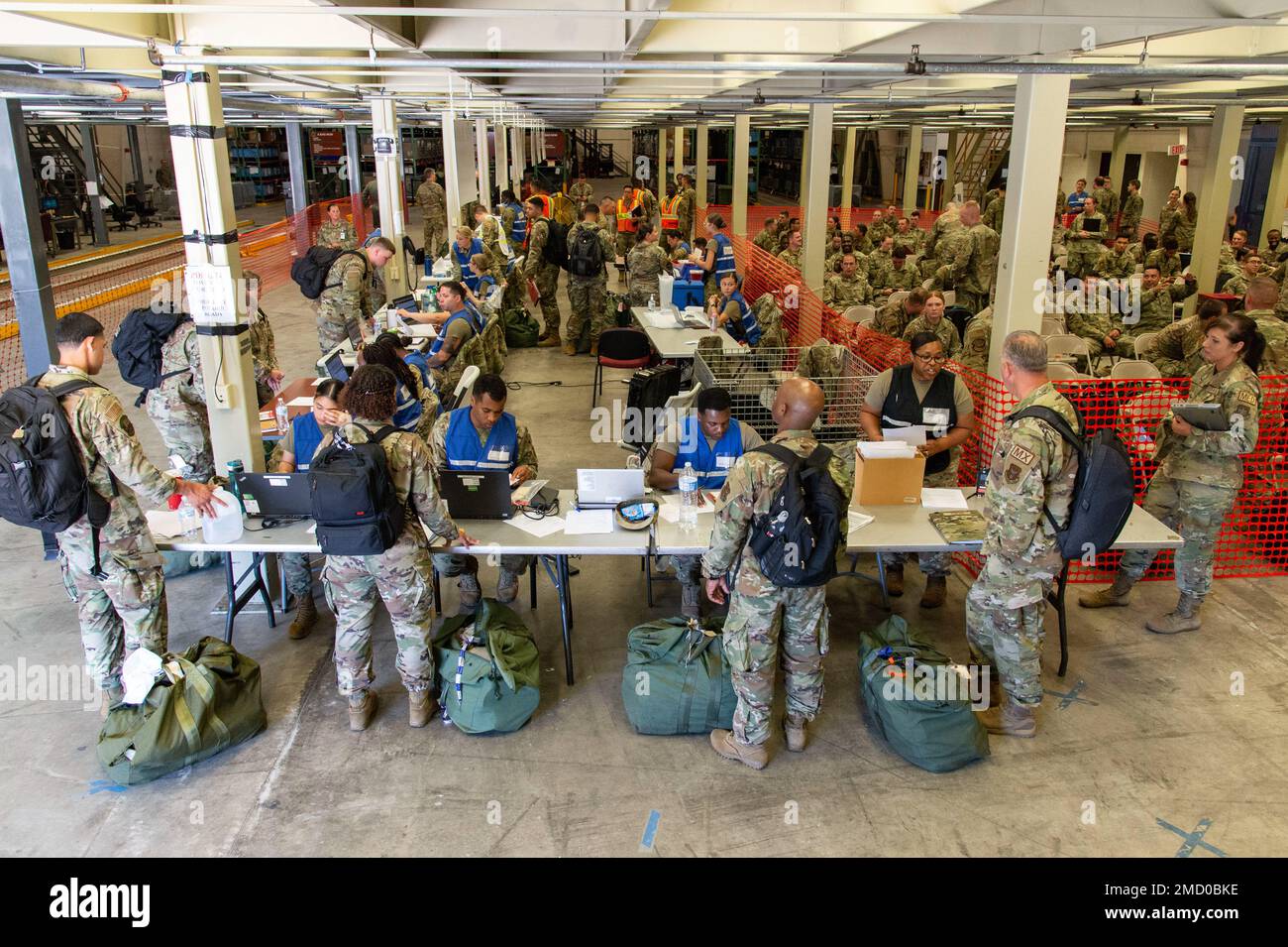 Team Dover members process through the personnel deployment function ...