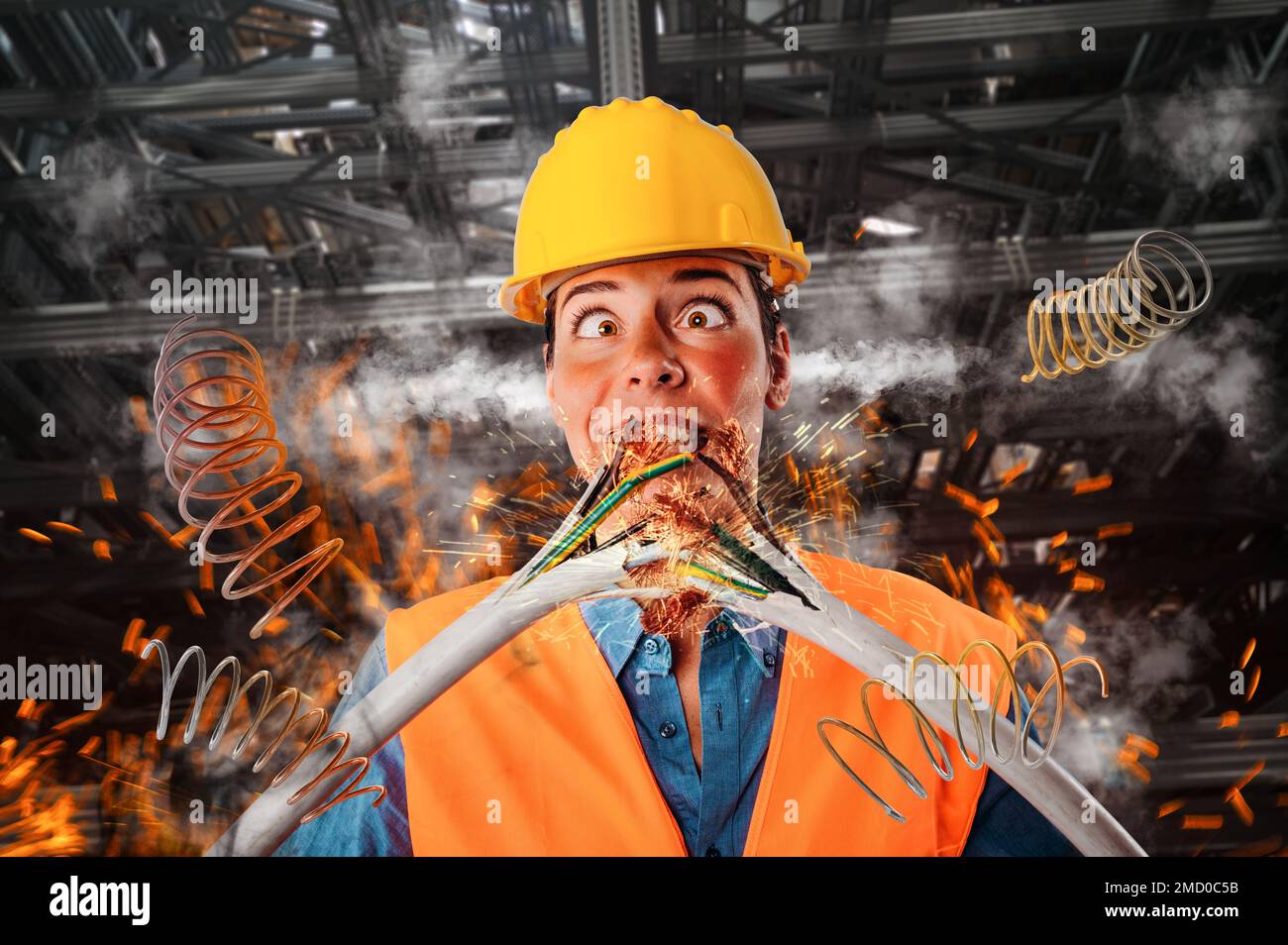 Astonished worker girl with hat breaks an electric cable Stock Photo ...