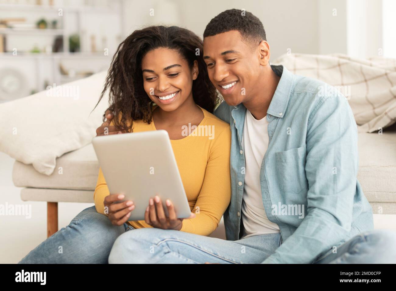 Technology for new normal at home. Glad millennial african american man ...