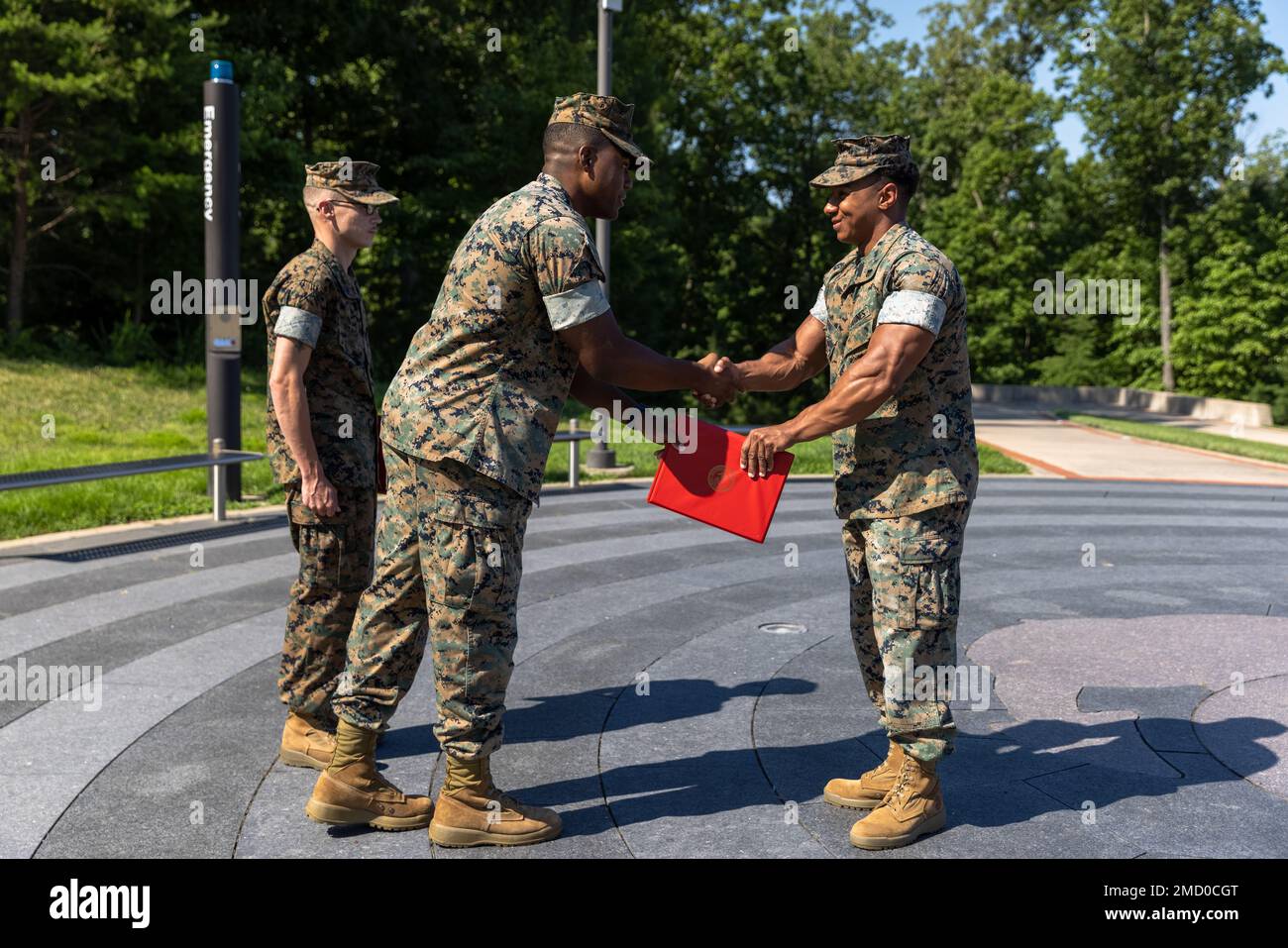 U.S. Marine Corps Cpl. Webster Rison, a combat graphics specialist, and ...