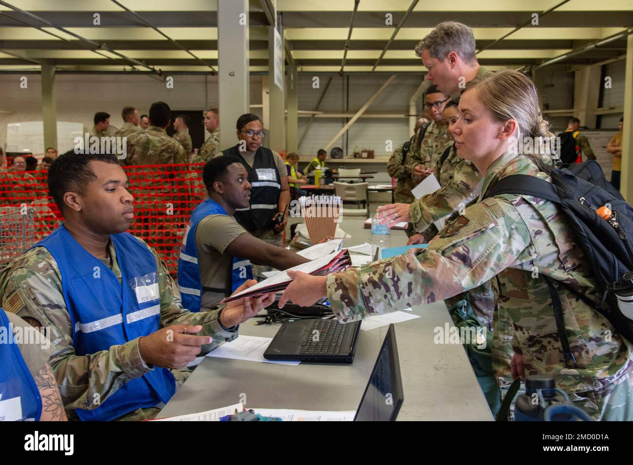 Team Dover members process through the personnel deployment function ...