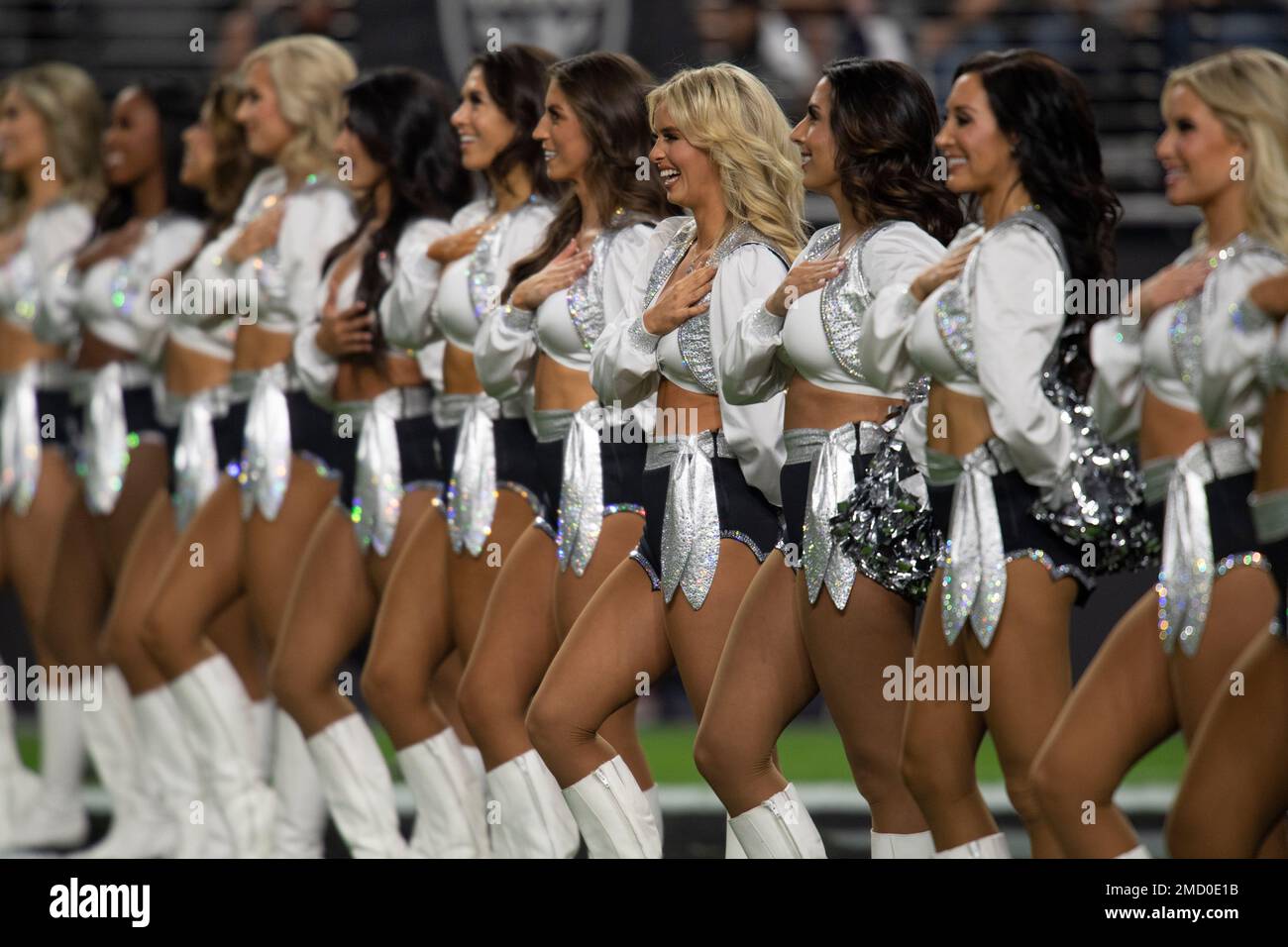 Las Vegas Raiders cheerleaders line up for the national anthem on the ...
