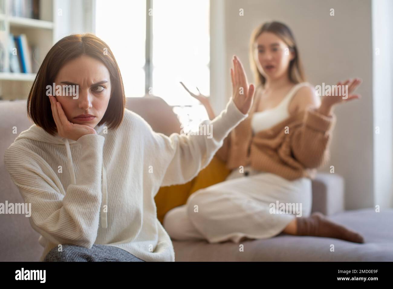 Sad european young woman making stop gesture with hand, ignores angry ...