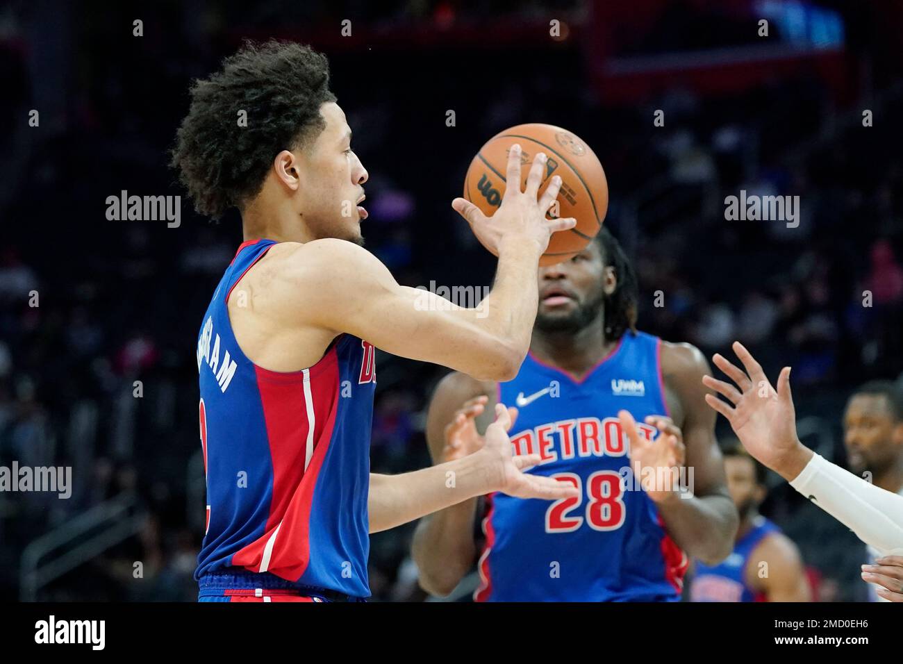 Detroit Pistons guard Cade Cunningham passes to center Isaiah Stewart ...