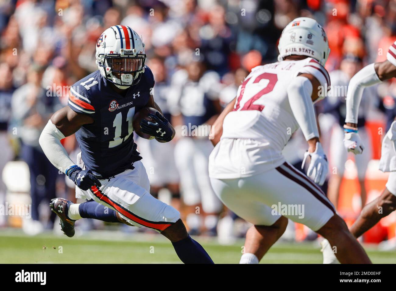 Auburn wide receiver Shedrick Jackson (11) tries to elude the tackle of ...