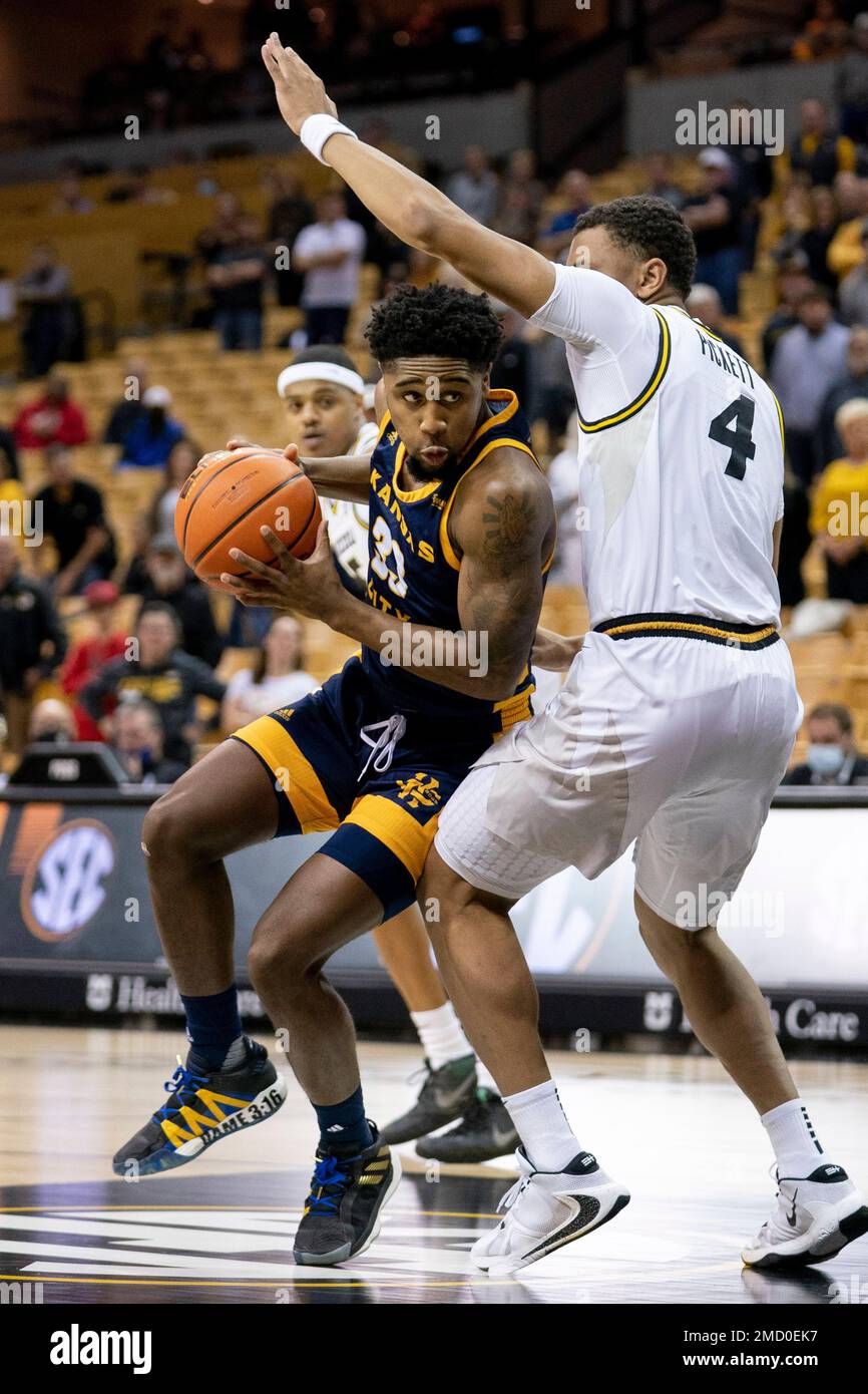 Kansas City's Marvin Nesbitt Jr., left, shoots past Missouri's Javon ...
