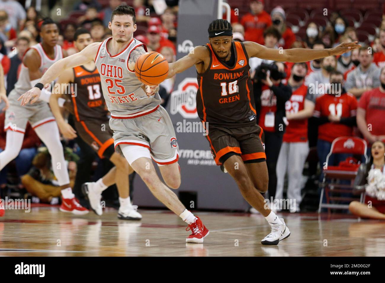 Ohio State's Kyle Young, left, and Bowling Green's Cam Young chase the ...