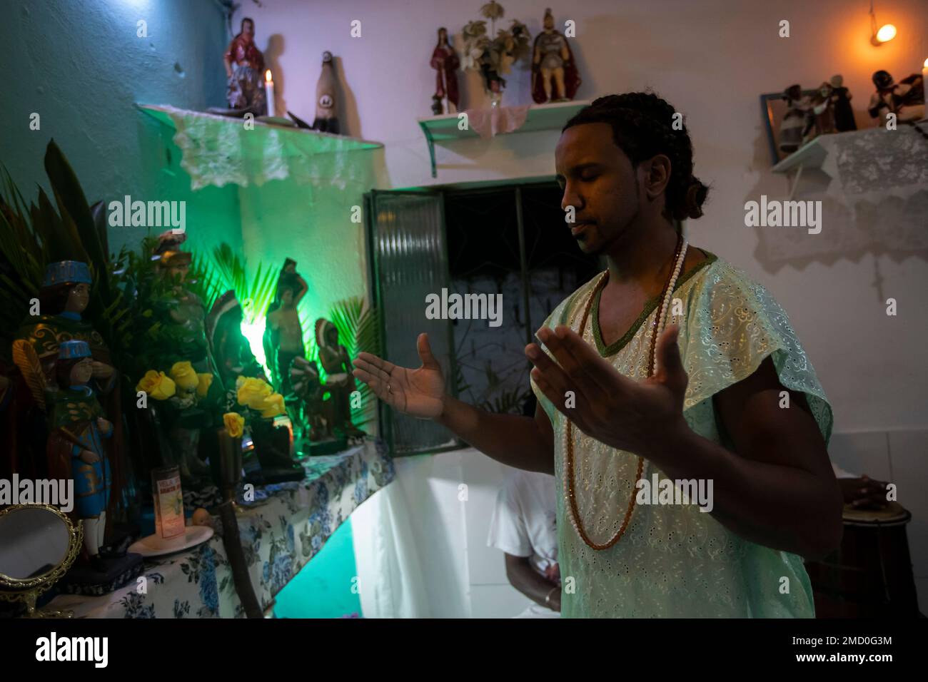 A devotee prays during a Umbanda religious ceremony at the Xangô das ...