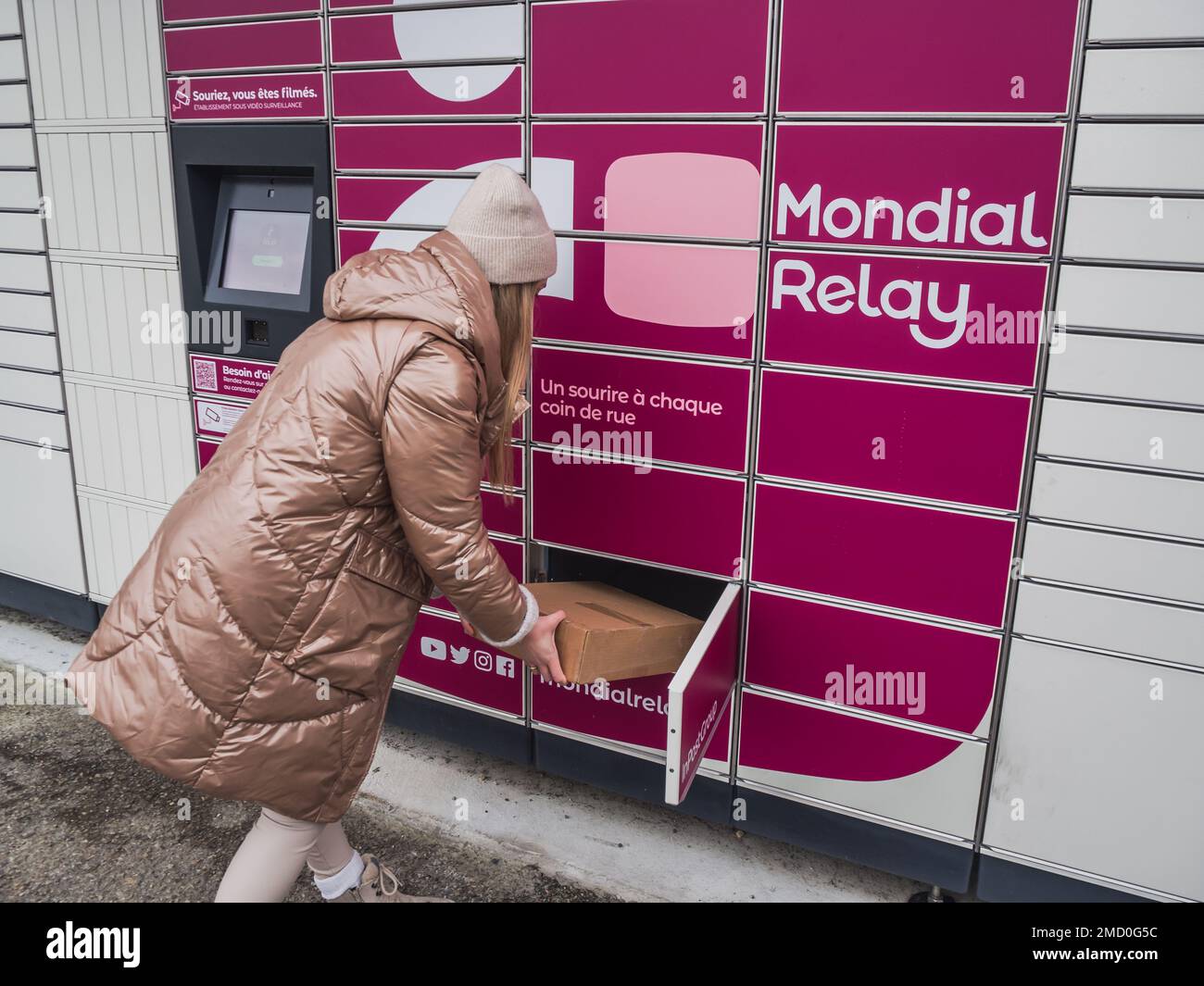 Loriol sur Drome, France - January 14, 2023: Picking up a parcel from a ...