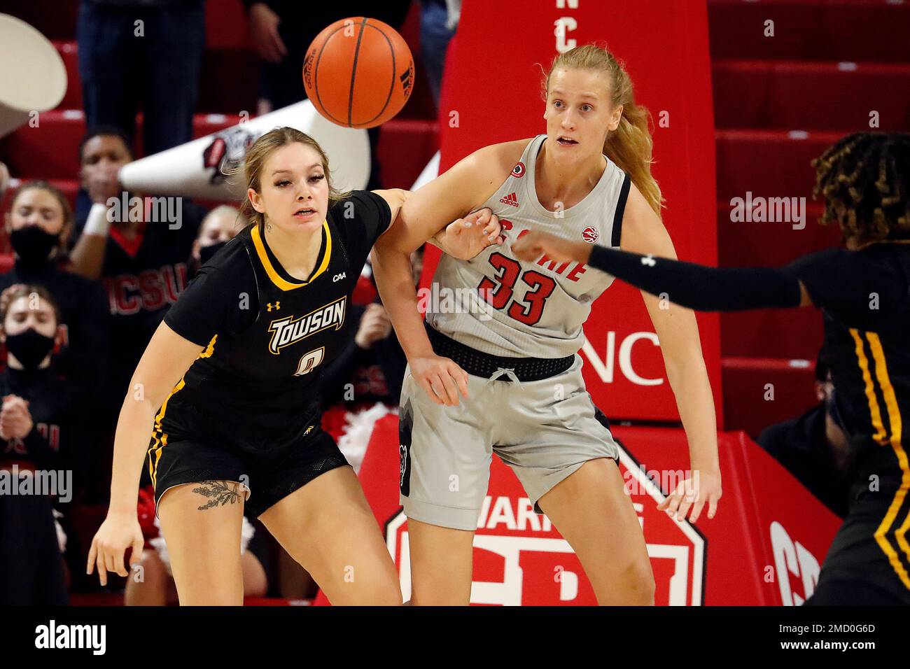 Towson's Allie Kubek (0) battles with North Carolina State's Elissa ...