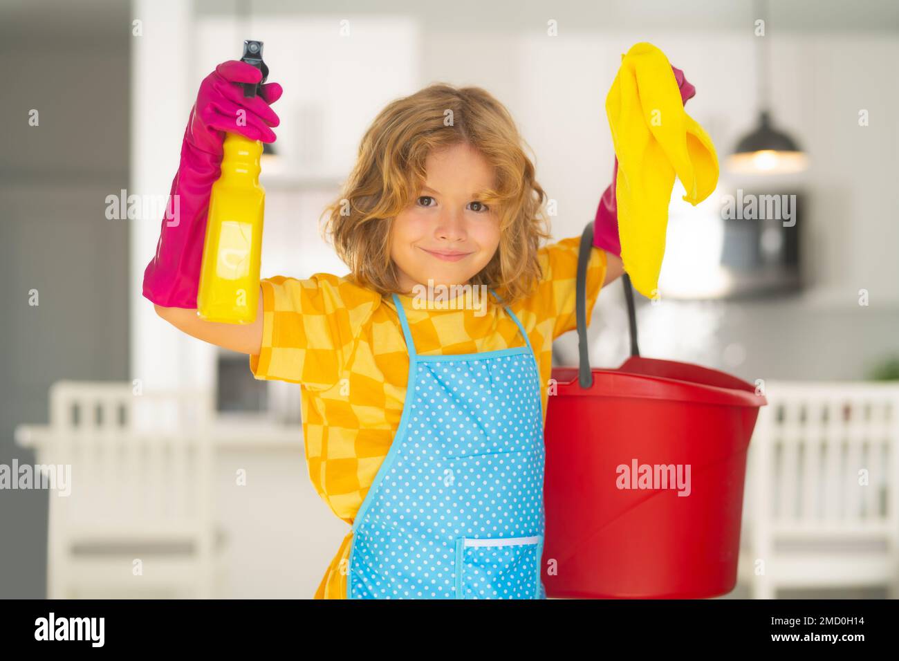 Little kid cleaning at home. Child doing housework having fun. Portrait ...